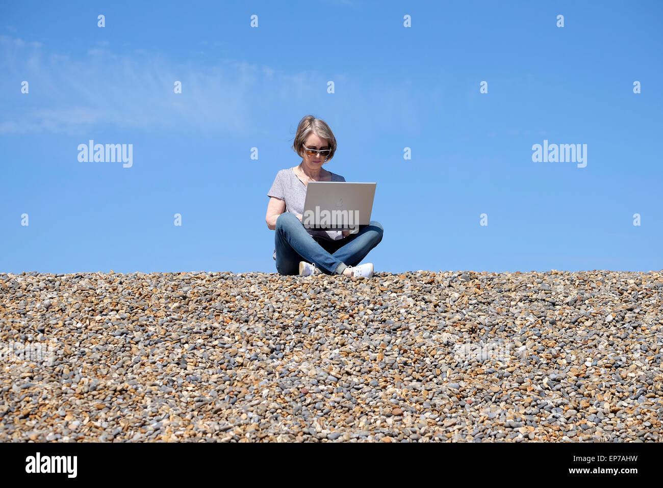 Woman on beach wearing hi-res stock photography and images - Alamy