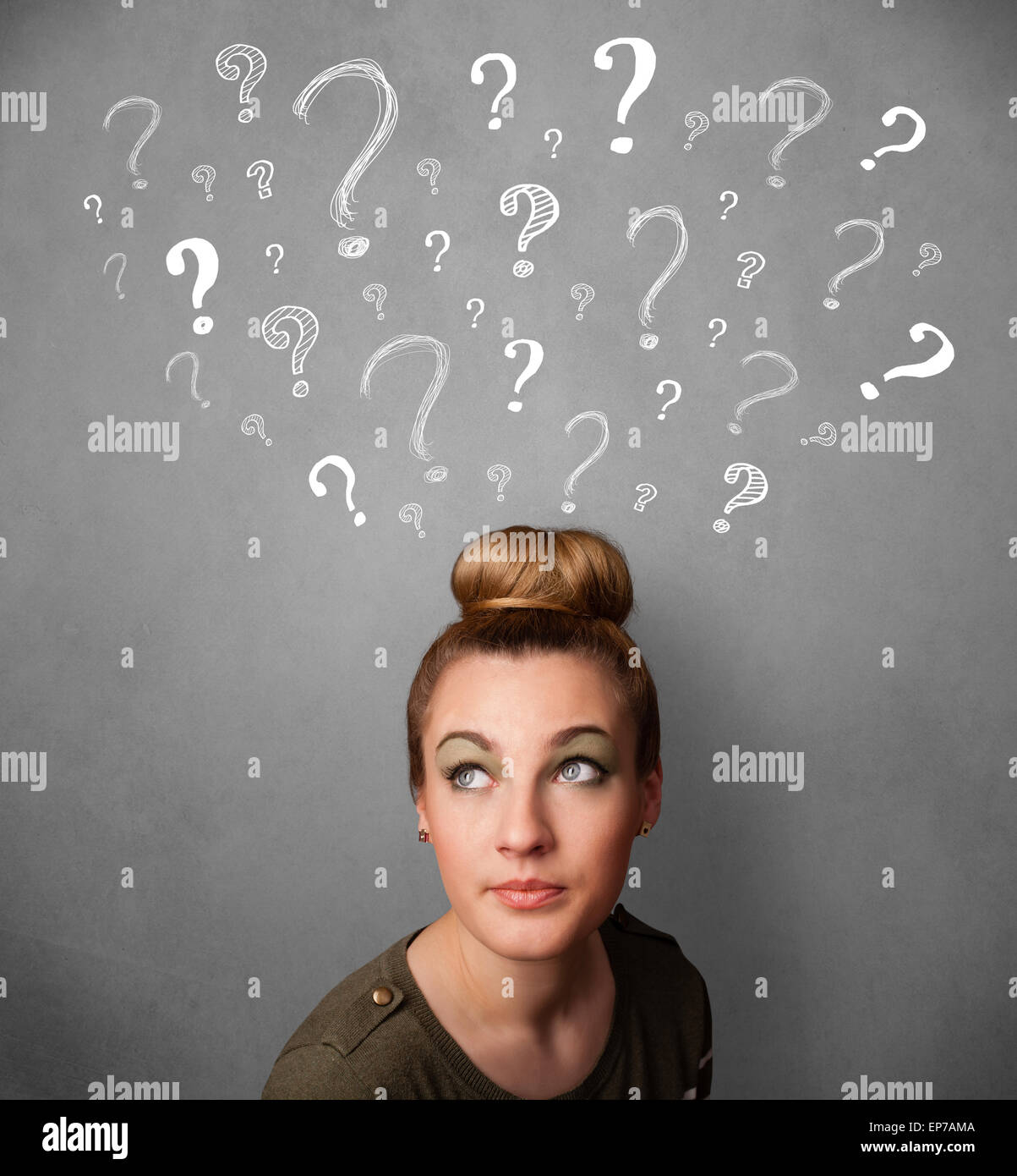 Young woman with question marks above her head Stock Photo - Alamy