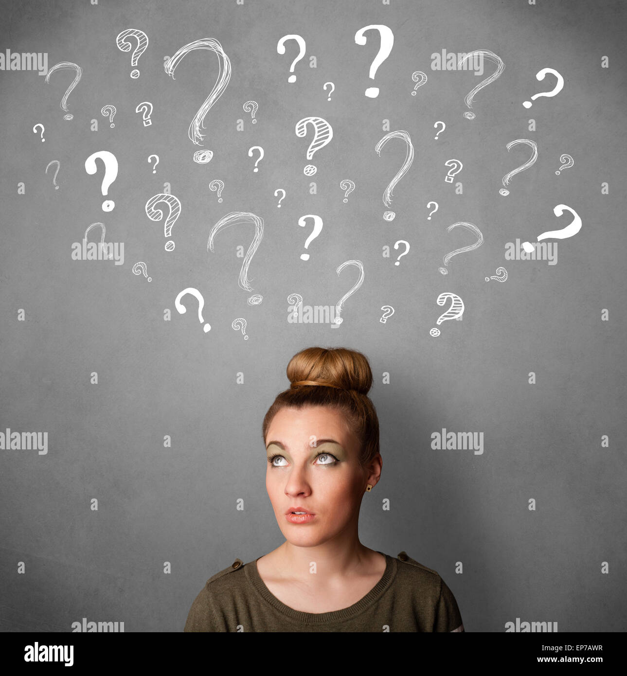 Young woman with question marks above her head Stock Photo - Alamy