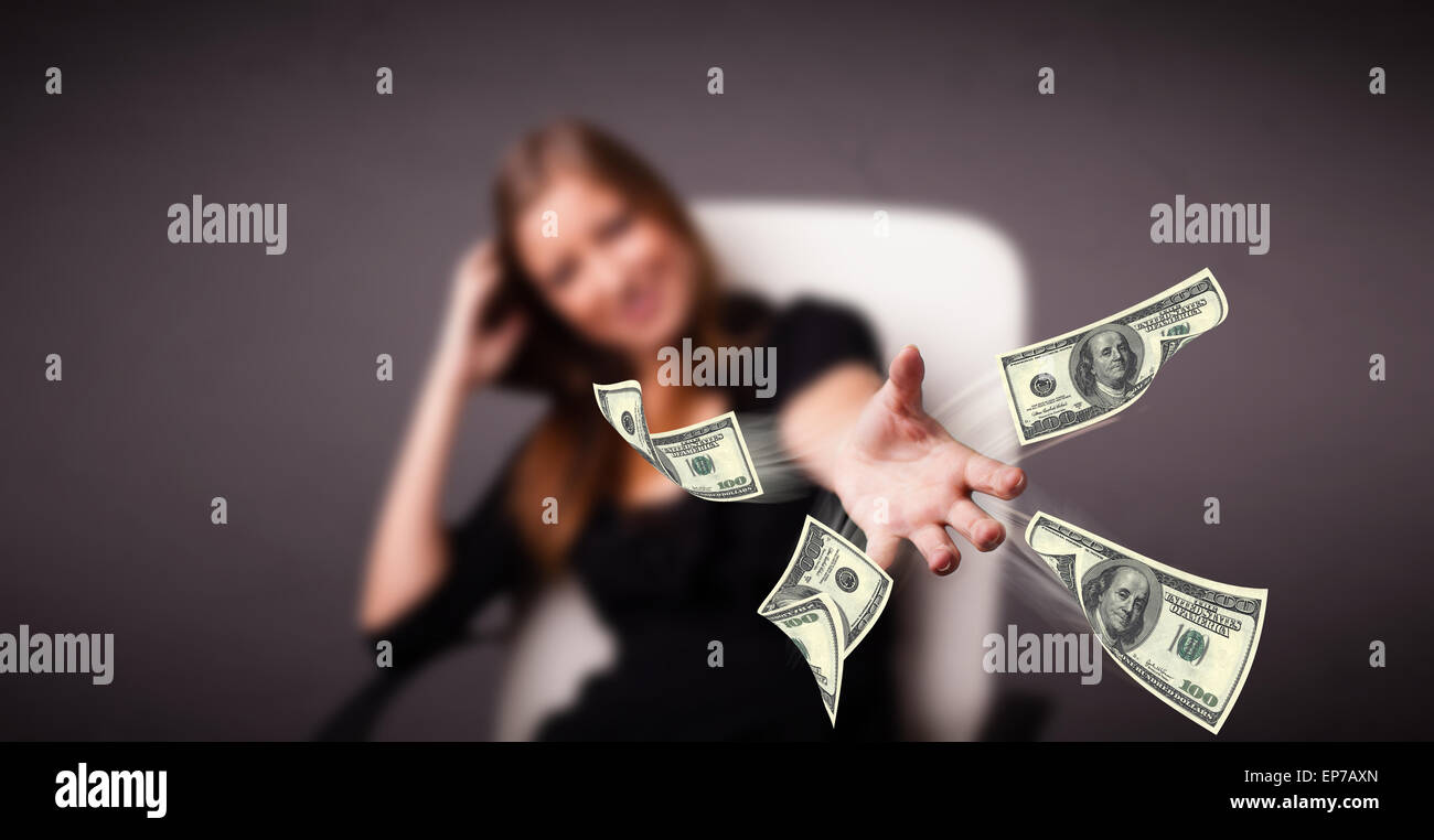Young girl throwing money Stock Photo - Alamy