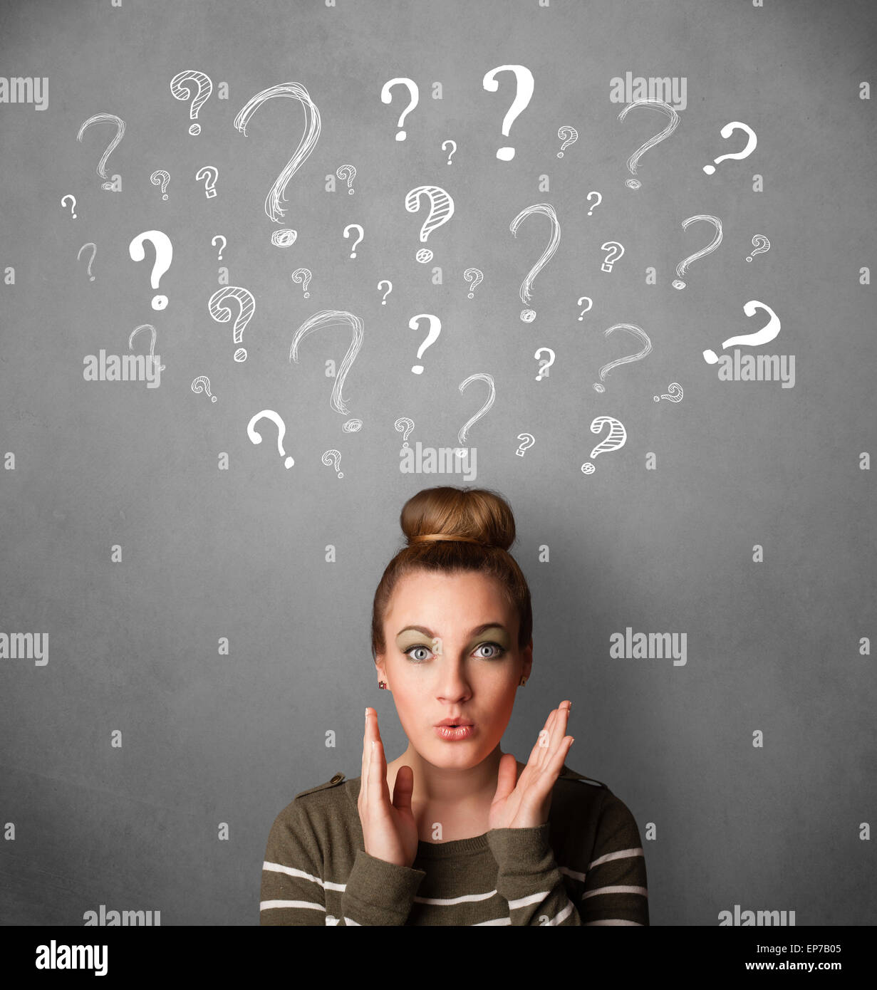 Young woman with question marks above her head Stock Photo - Alamy