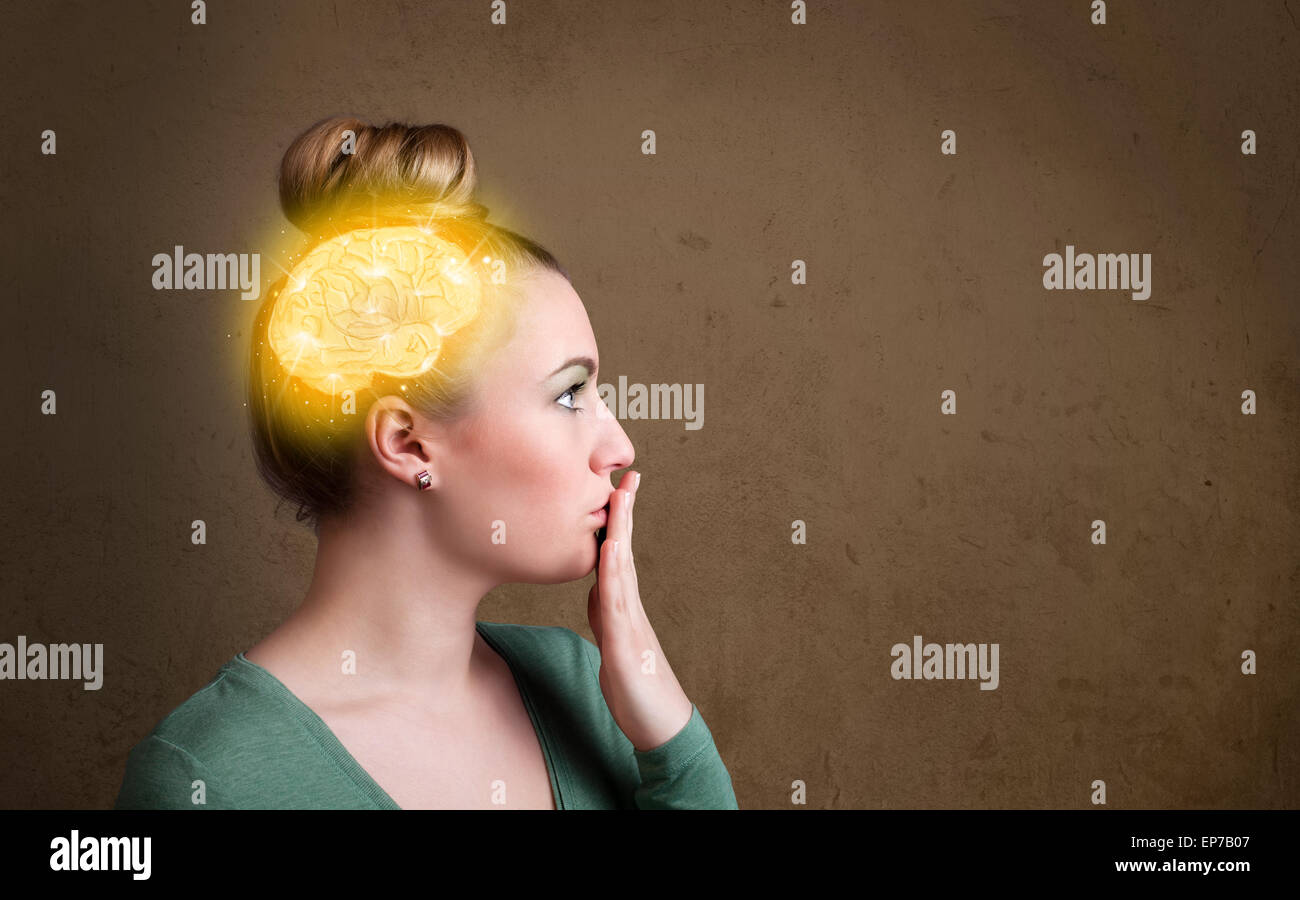 Young girl thinking with glowing brain illustration Stock Photo - Alamy