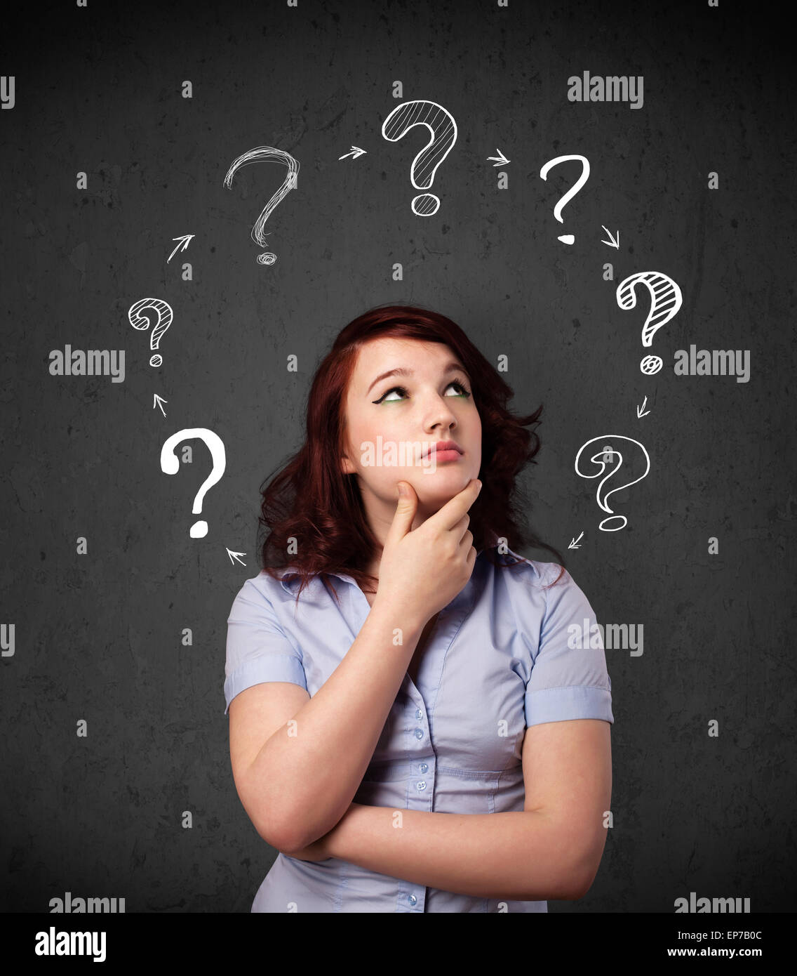 Young woman thinking with question mark circulation around her head ...