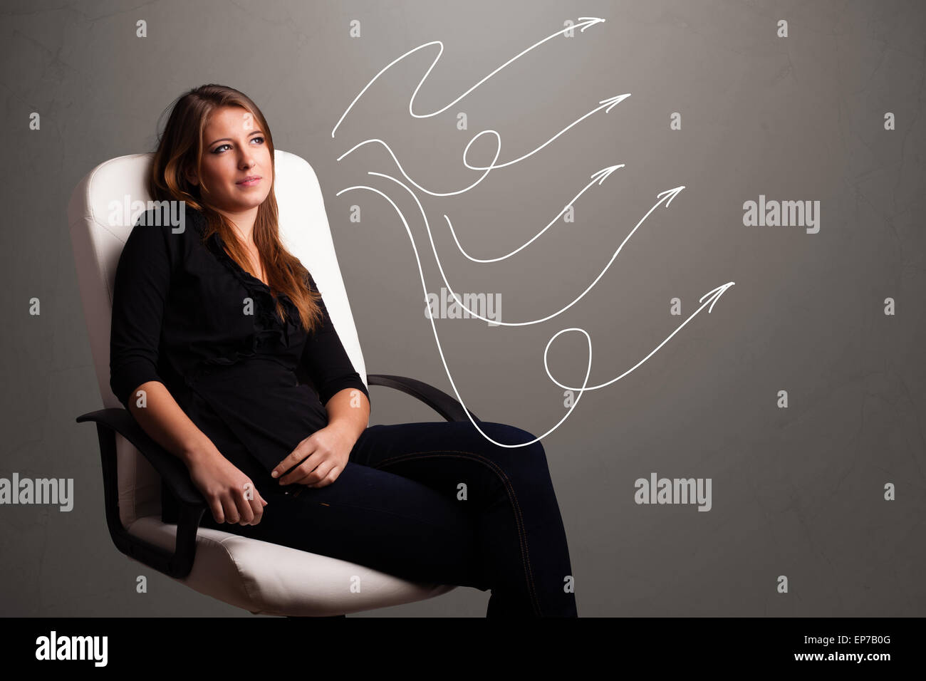 Attractive teenager looking at multiple curly arrows Stock Photo - Alamy