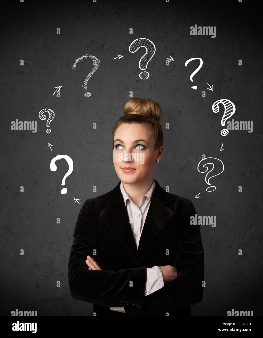 Young woman thinking with question mark circulation around her head ...