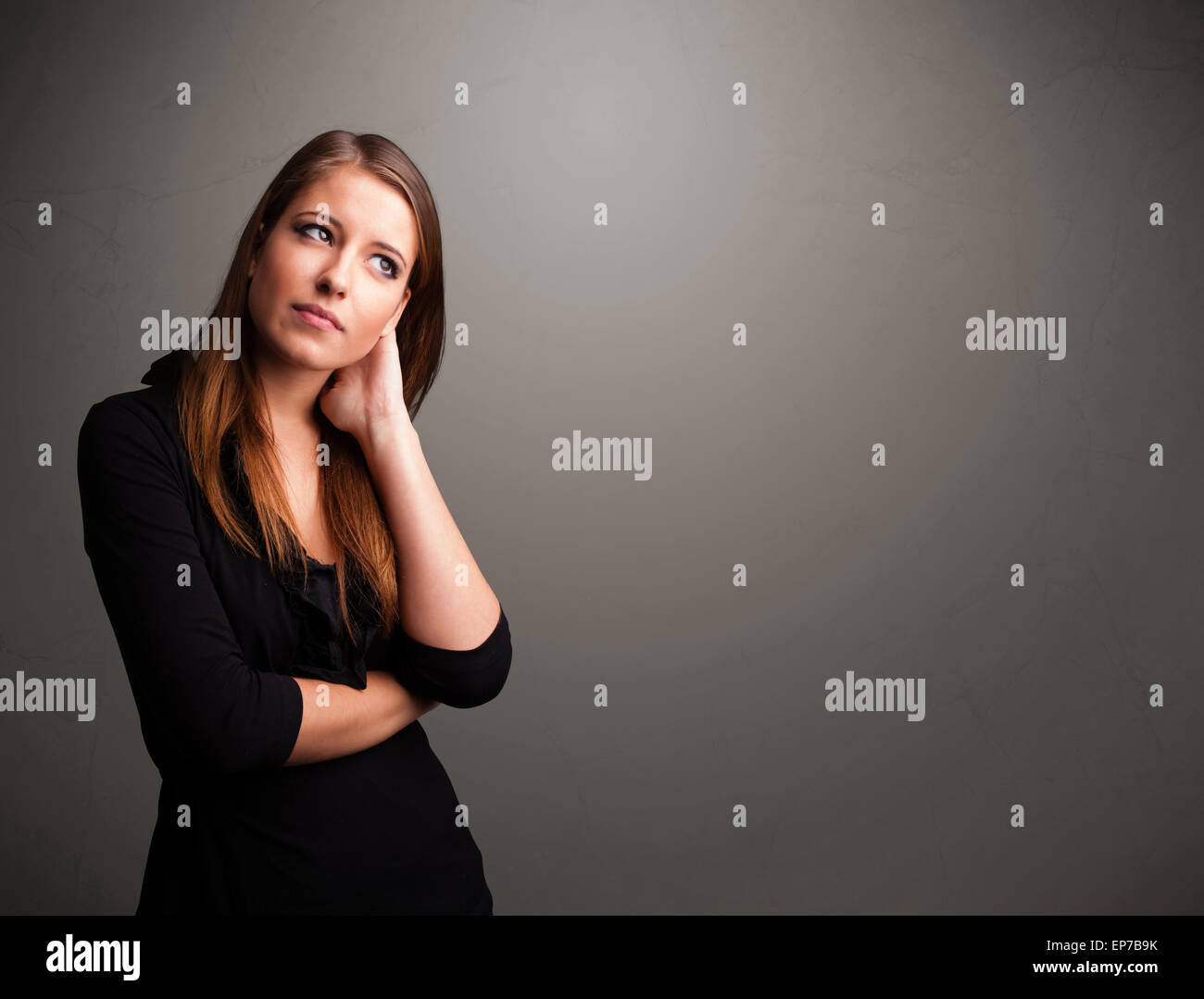 Beautiful woman thinking with empty copy space Stock Photo - Alamy