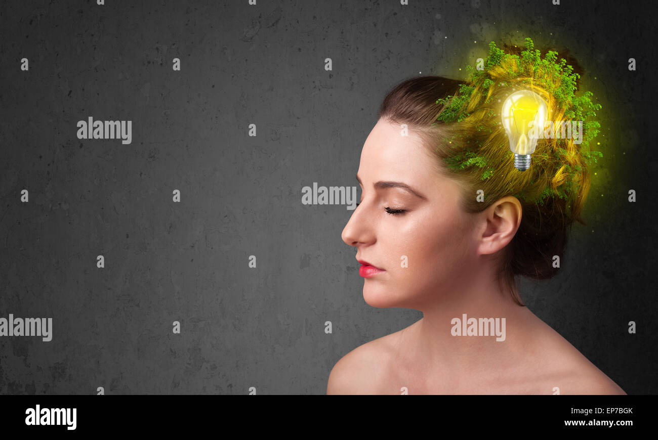Young mind thinking of green eco energy with lightbulb Stock Photo - Alamy