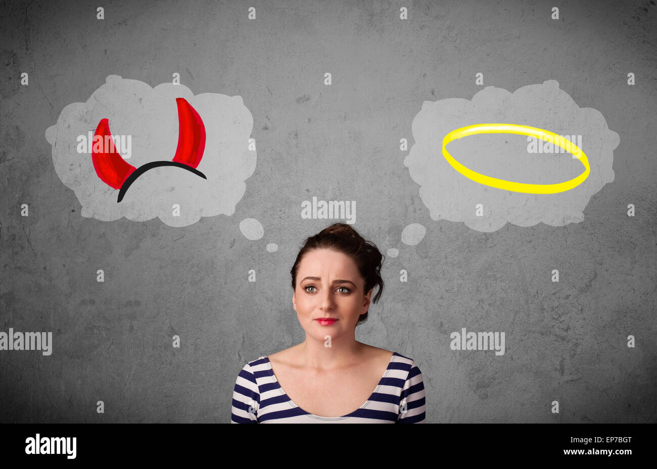 Woman choosing between good and bad Stock Photo - Alamy
