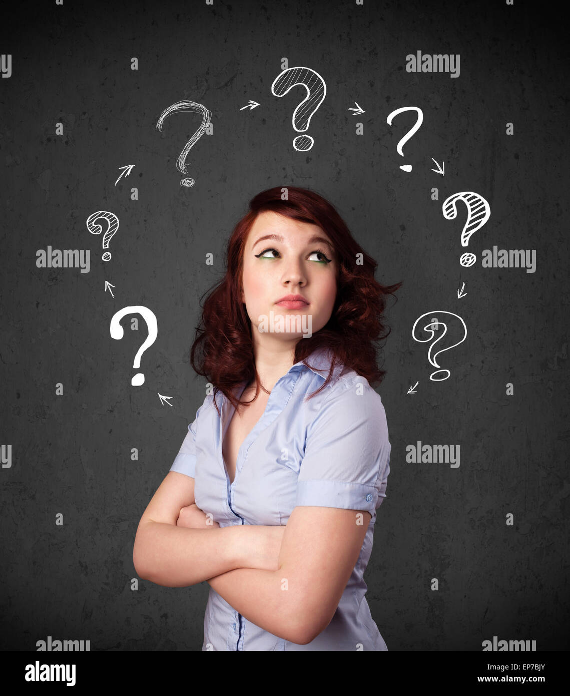 Young woman thinking with question mark circulation around her head ...