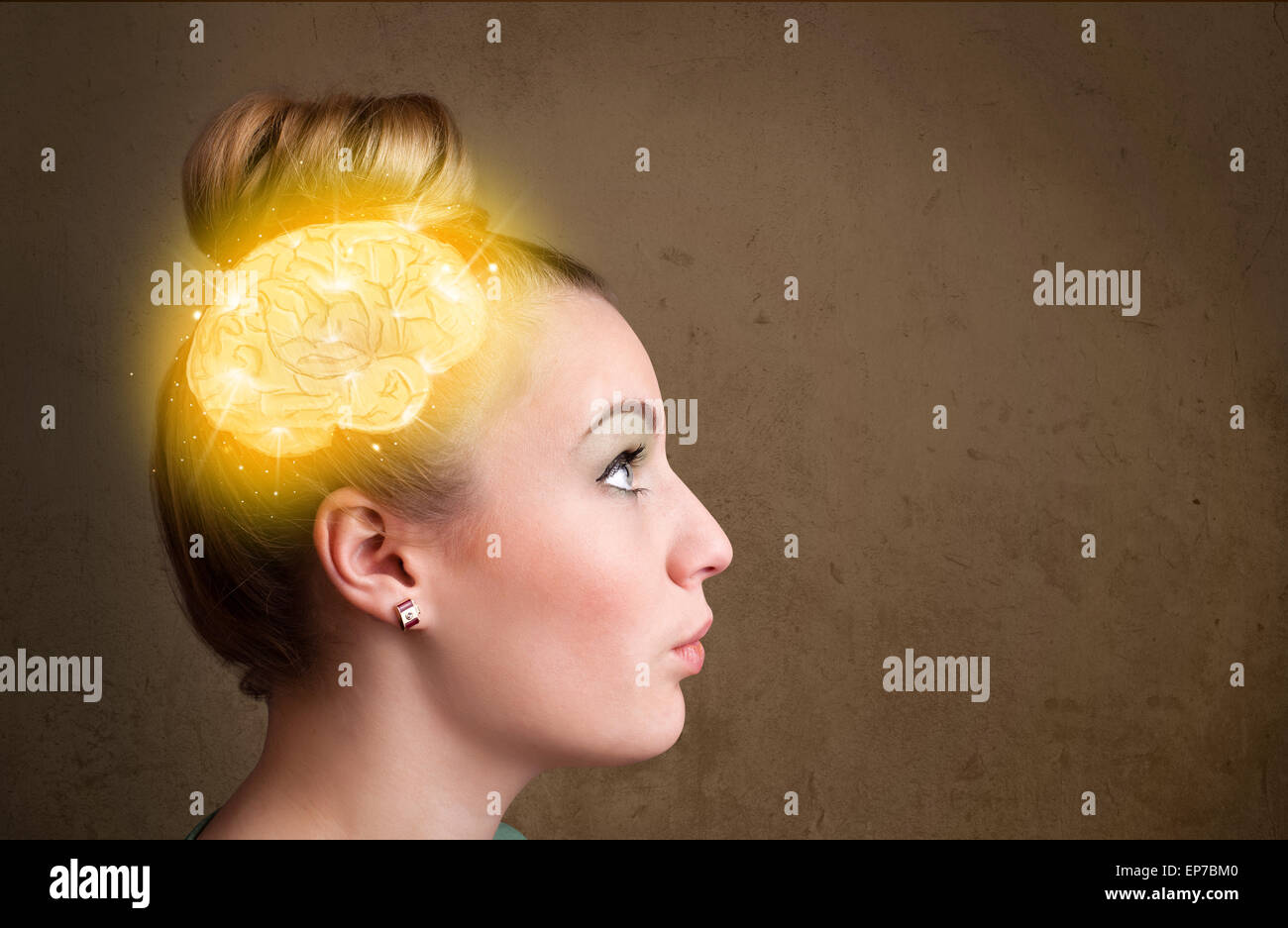Young girl thinking with glowing brain illustration Stock Photo - Alamy