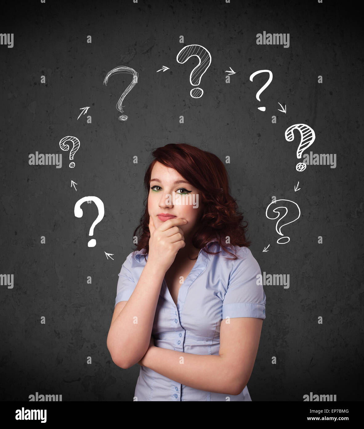 Young woman thinking with question mark circulation around her head ...