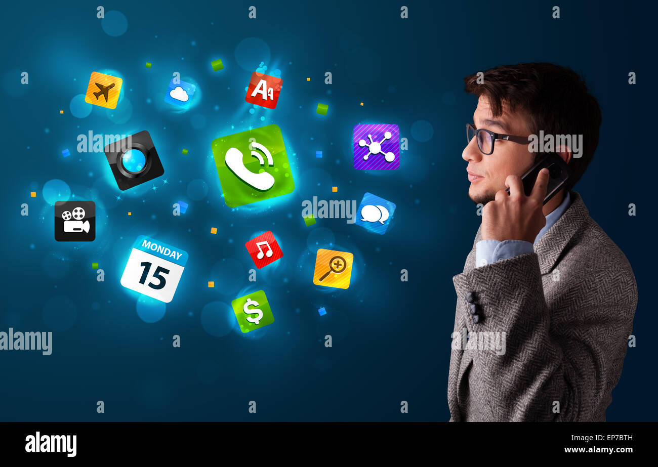 Young man calling by phone with various icons Stock Photo - Alamy
