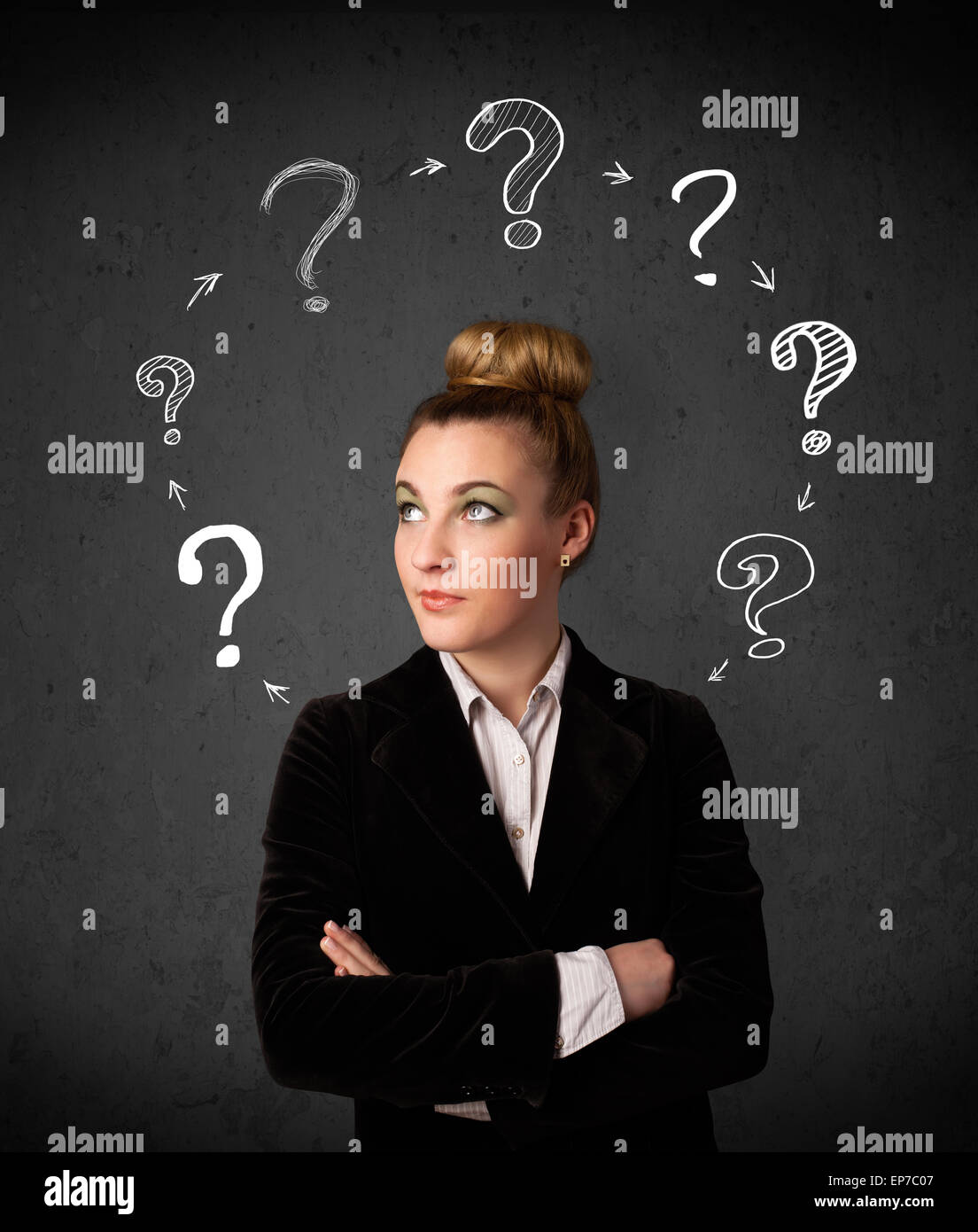 Young woman thinking with question mark circulation around her head ...