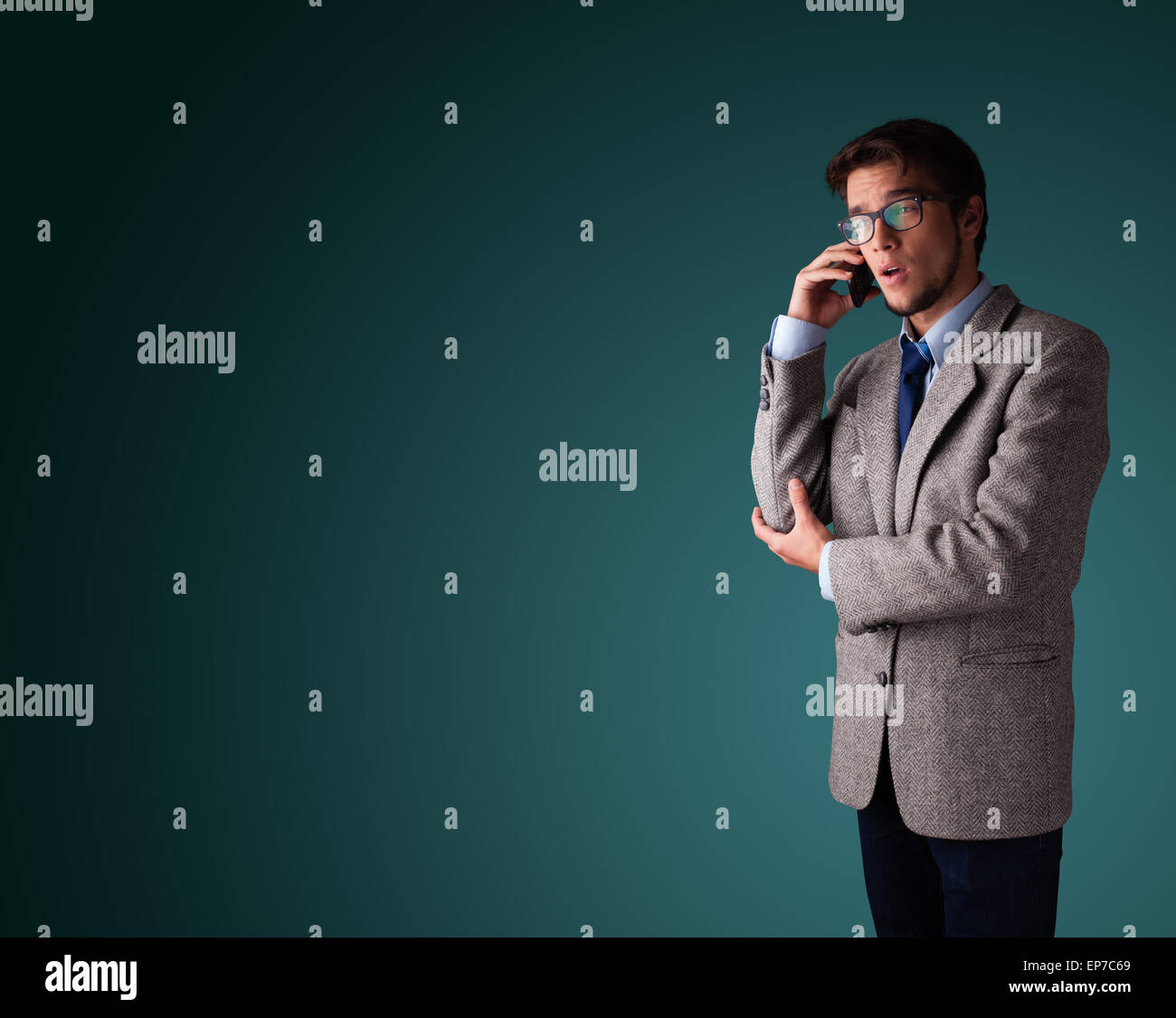 Young man making phone call with copy space Stock Photo - Alamy