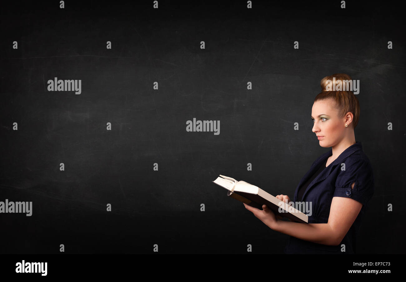Young lady reading a book Stock Photo - Alamy