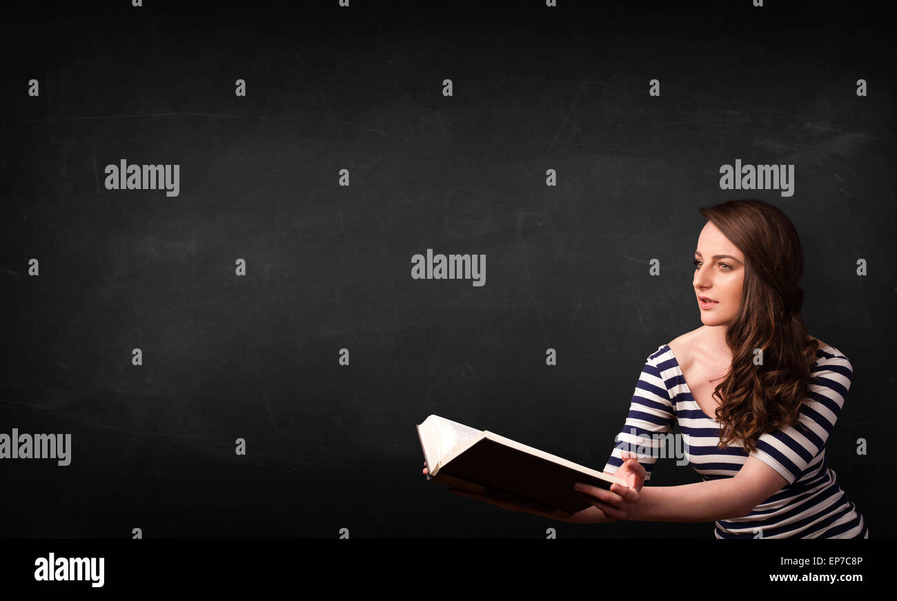 Young lady reading a book Stock Photo - Alamy