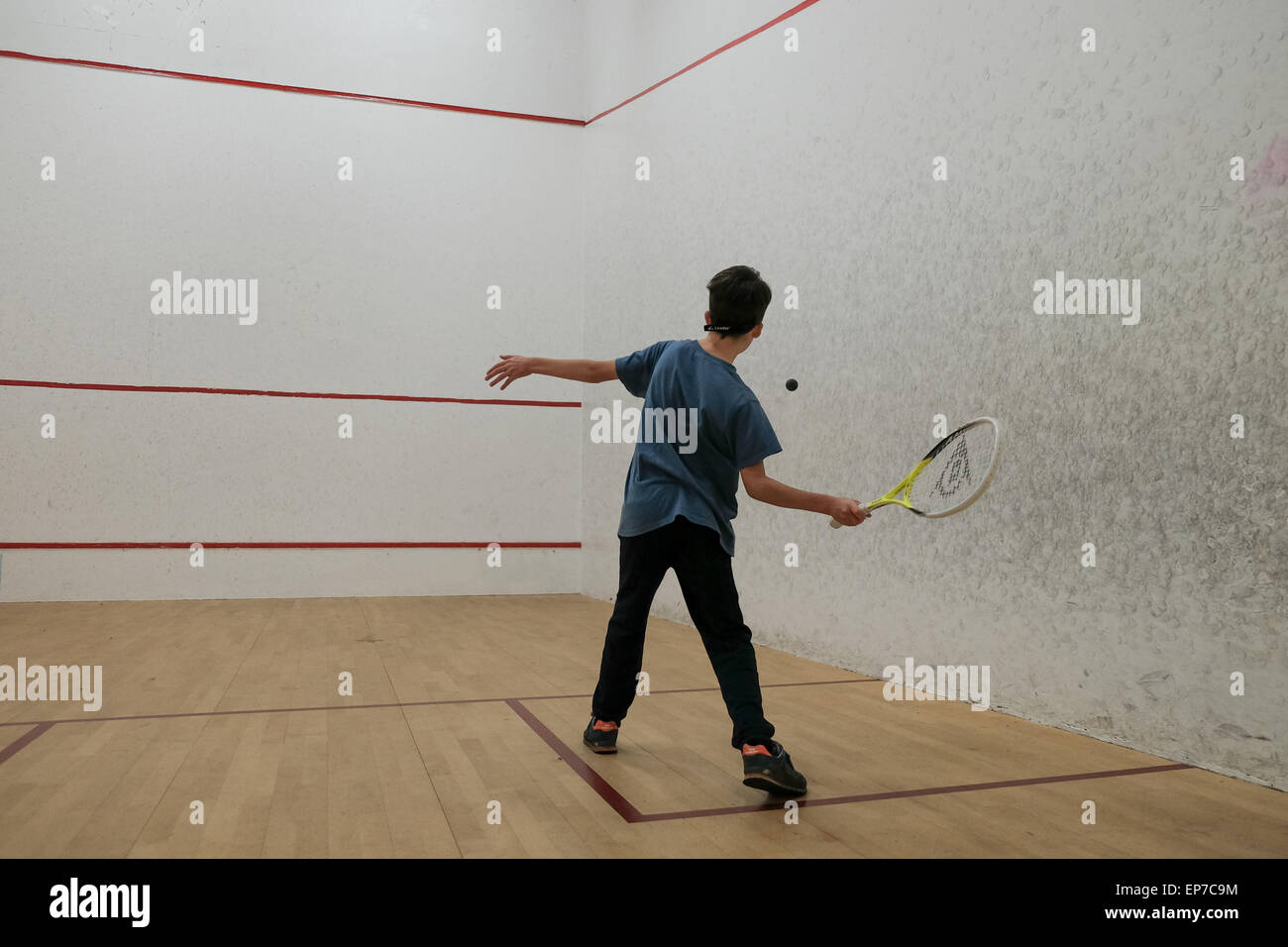 A young boy plays squash Stock Photo - Alamy
