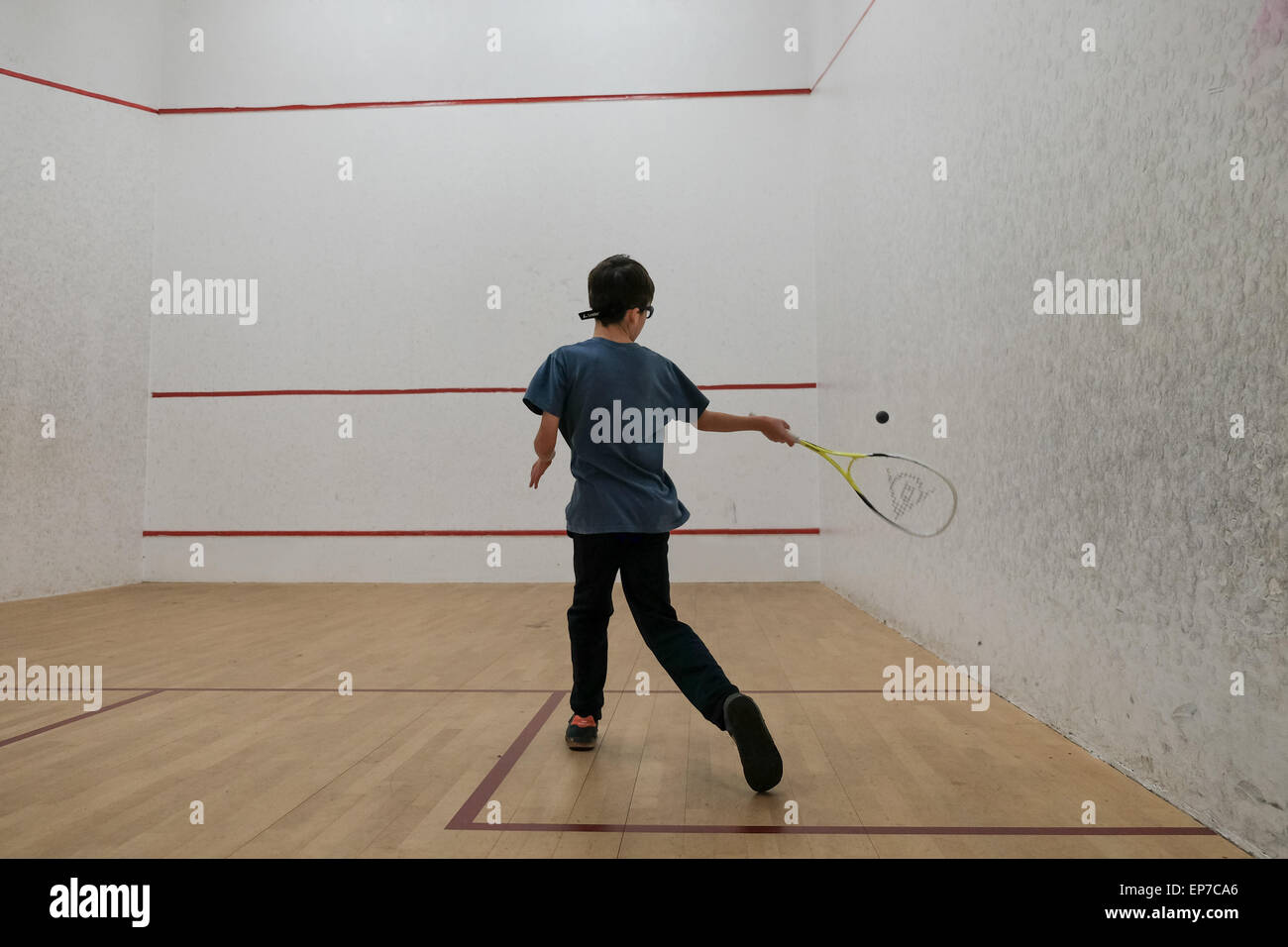 A young boy plays squash Stock Photo - Alamy