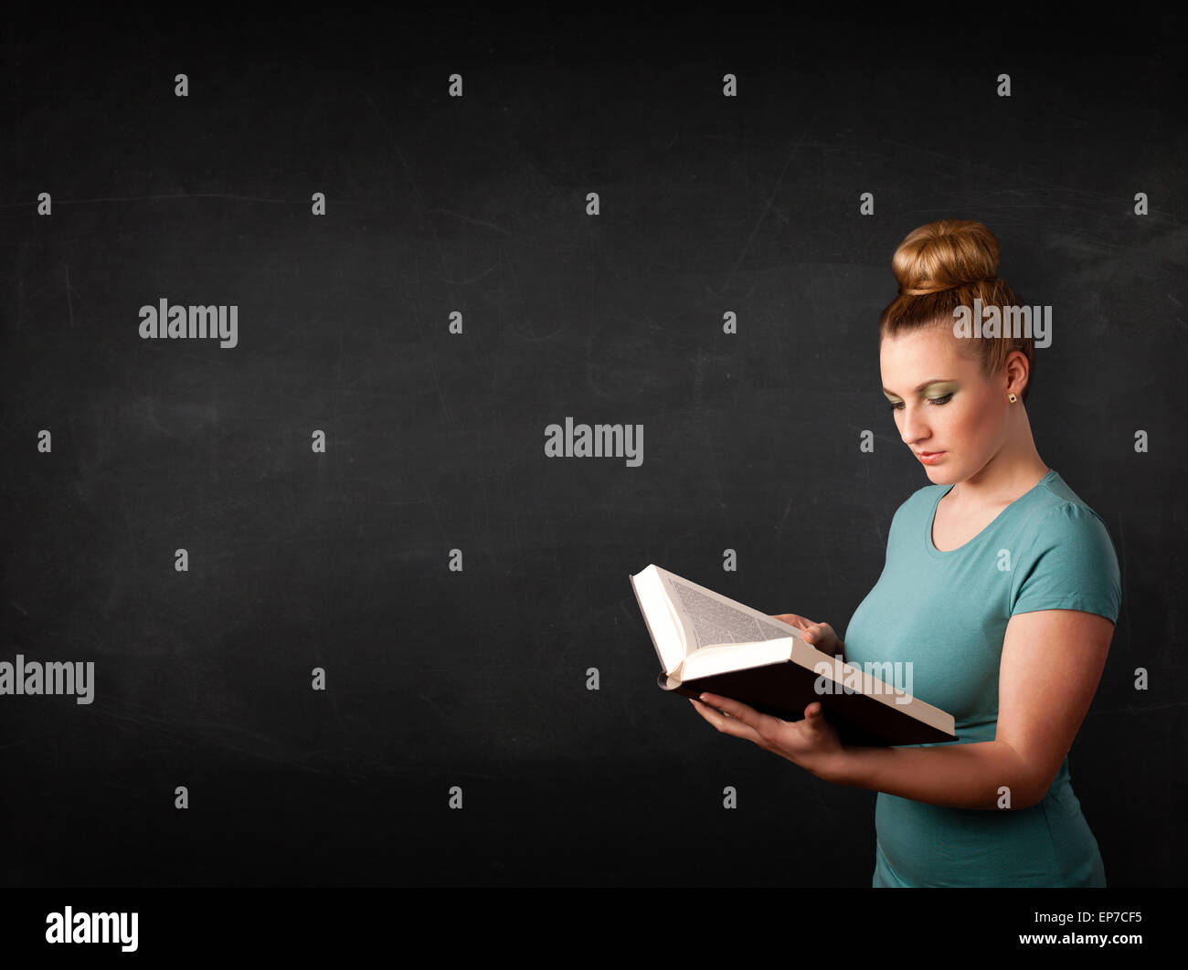 Young lady reading a book Stock Photo - Alamy