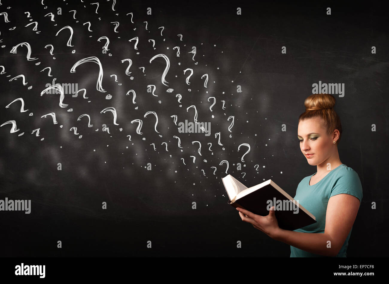 Pretty woman reading a book with question marks coming out from it ...