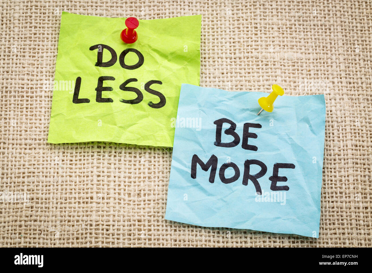 do less be more motivation - reminder on sticky notes Stock Photo - Alamy