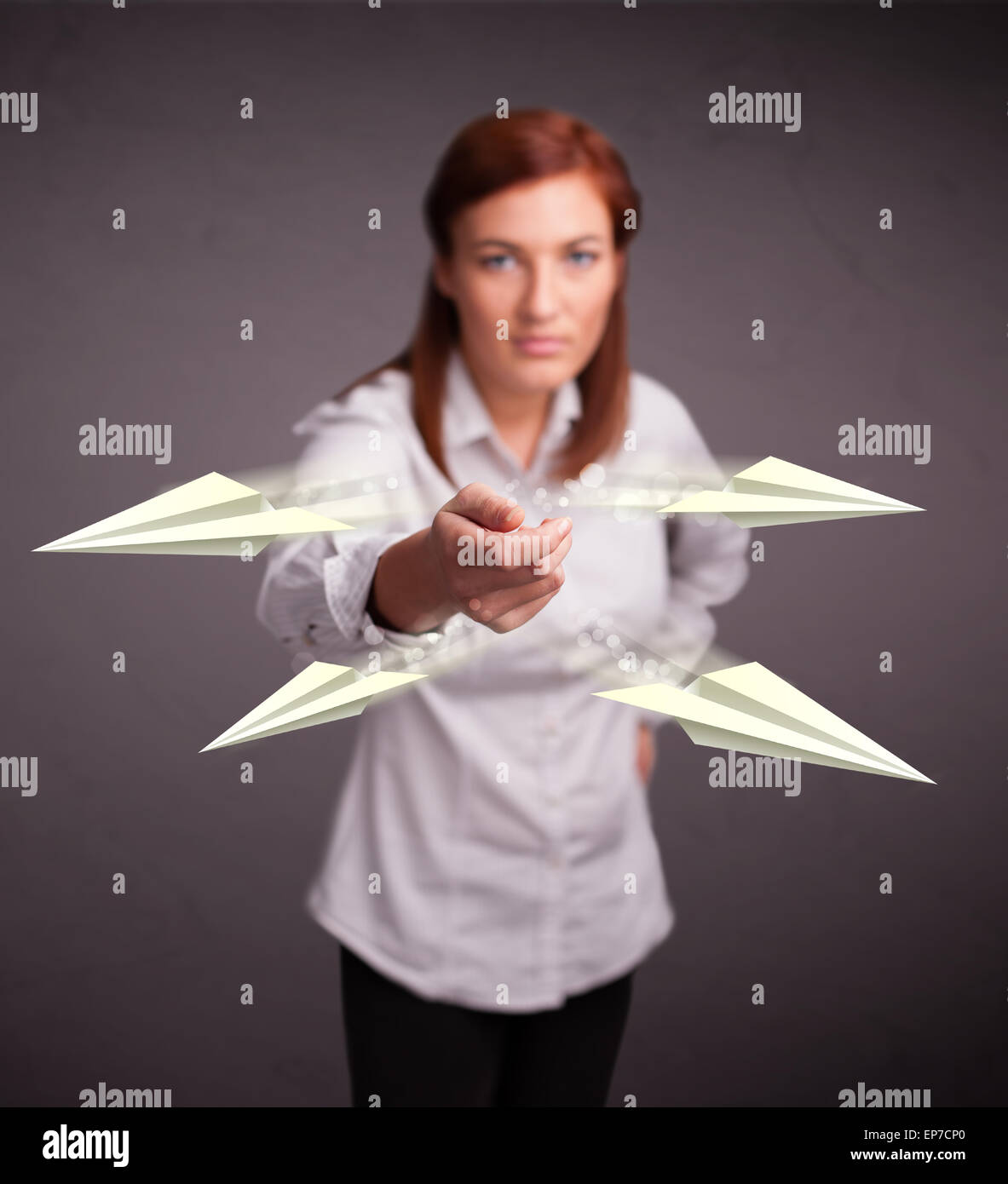Beautiful lady throwing origami airplanes Stock Photo - Alamy
