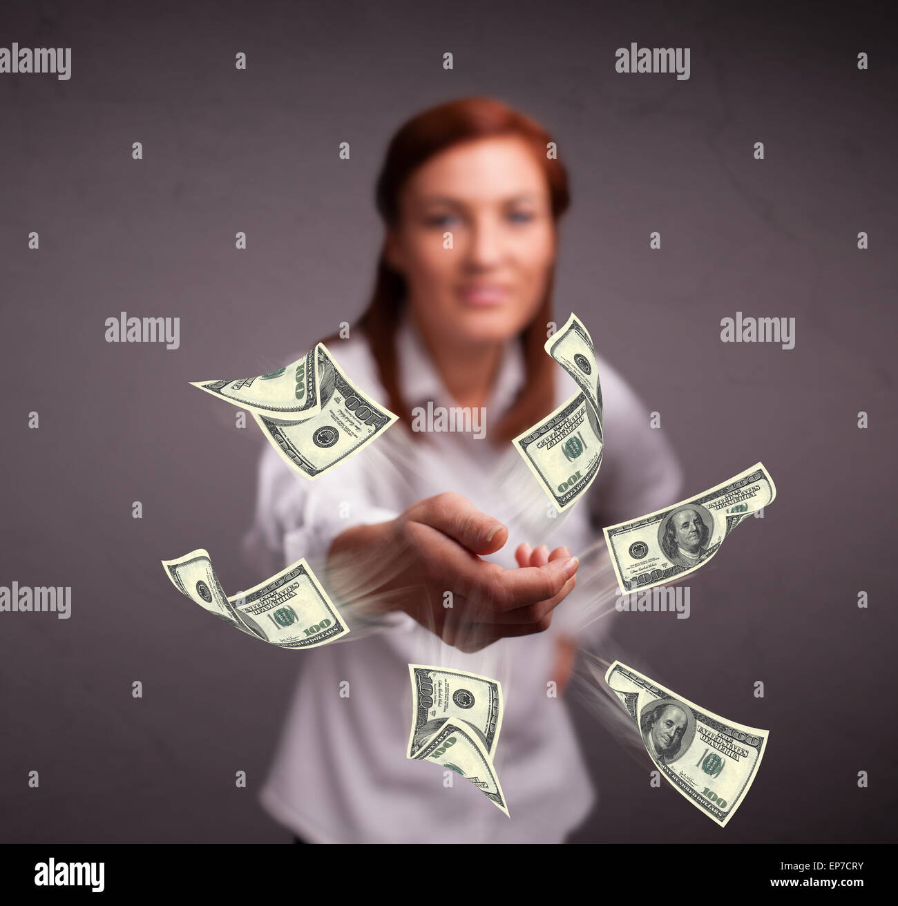 Young girl throwing money Stock Photo - Alamy
