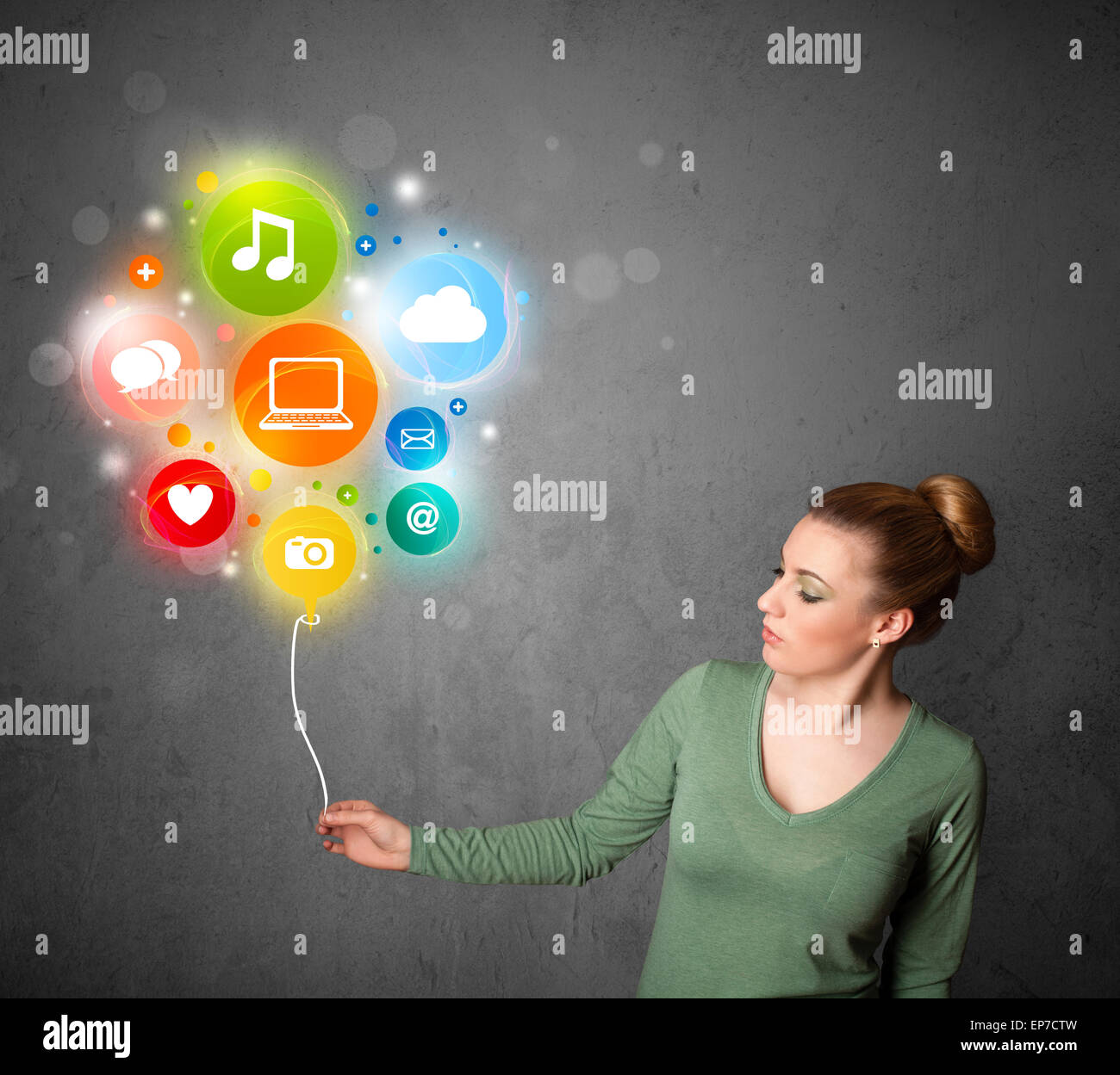 Woman holding social media balloon Stock Photo - Alamy