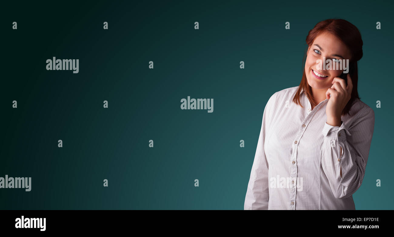 Young woman making phone call with copy space Stock Photo - Alamy