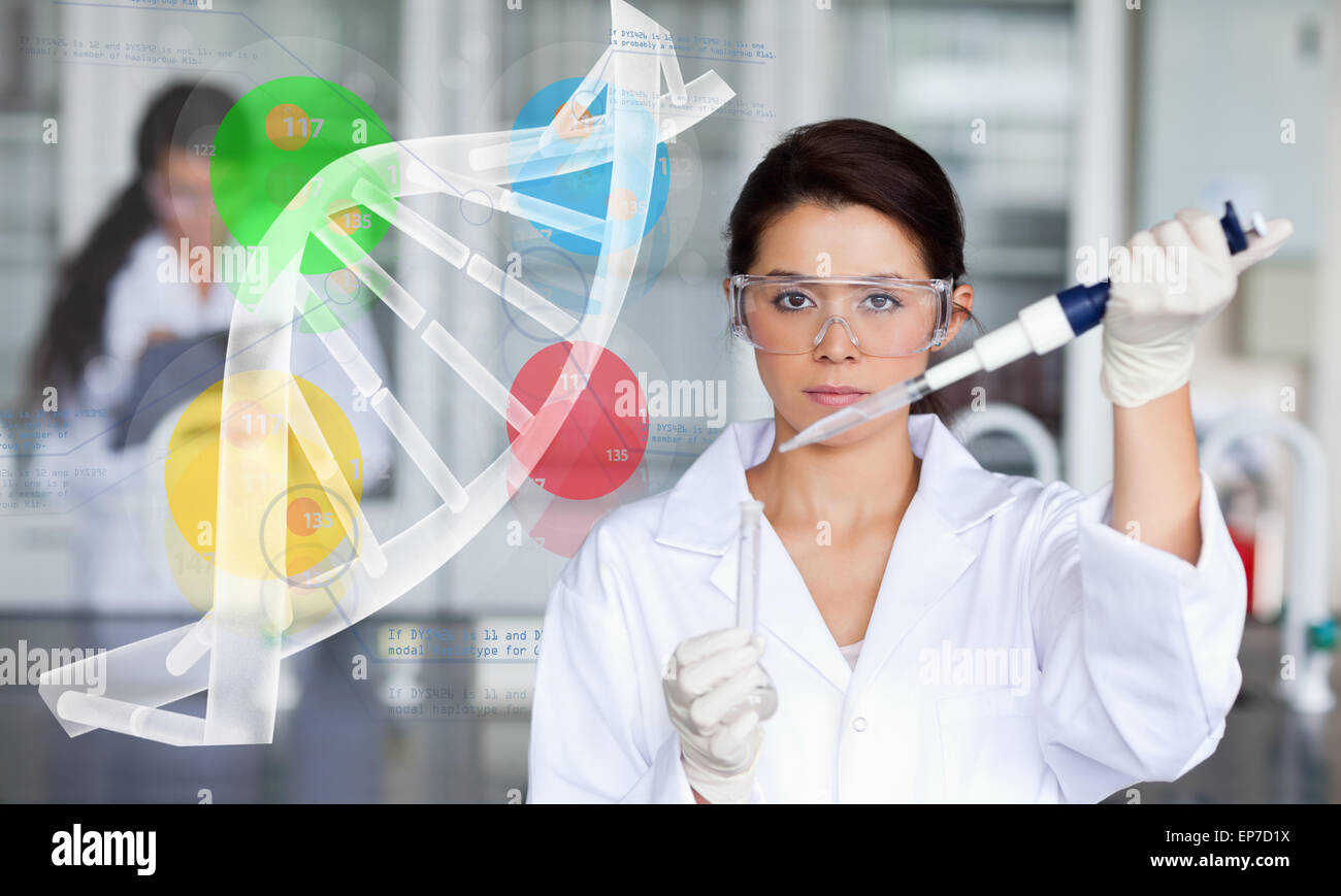 Serious chemist working with human dna helix interface Stock Photo - Alamy