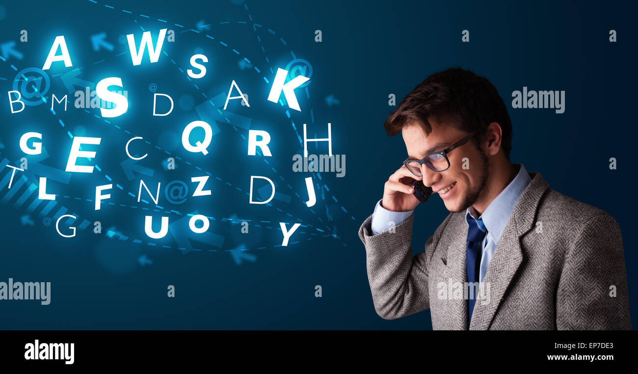 Young boy making phone call with shiny characters Stock Photo - Alamy