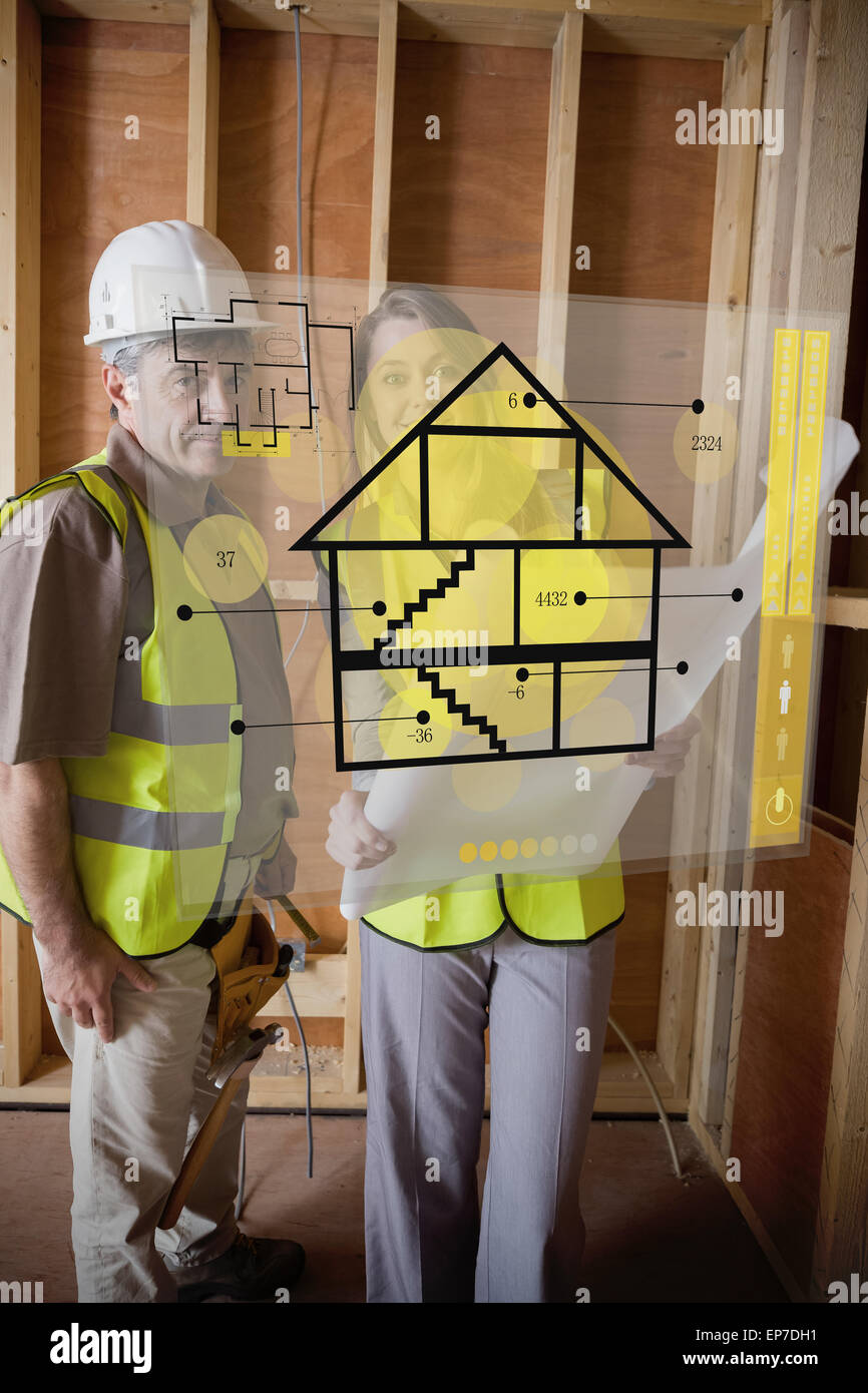 Architect and foreman standing behind house plan interface Stock Photo ...