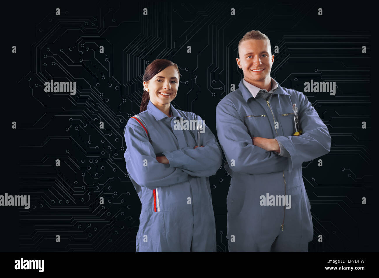 Mechanics standing in front of a circuit board background Stock Photo ...