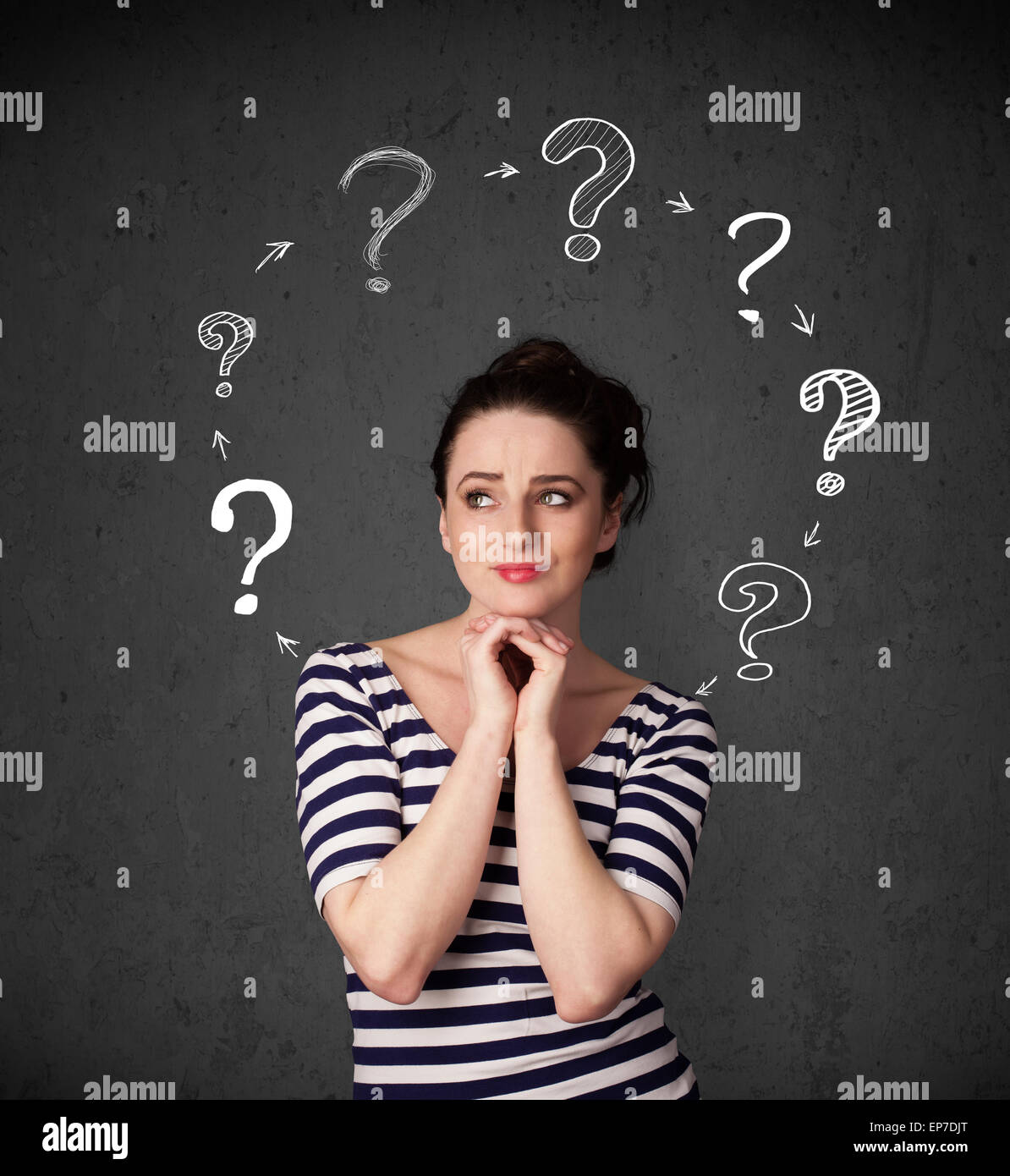 Young woman thinking with question mark circulation around her head ...