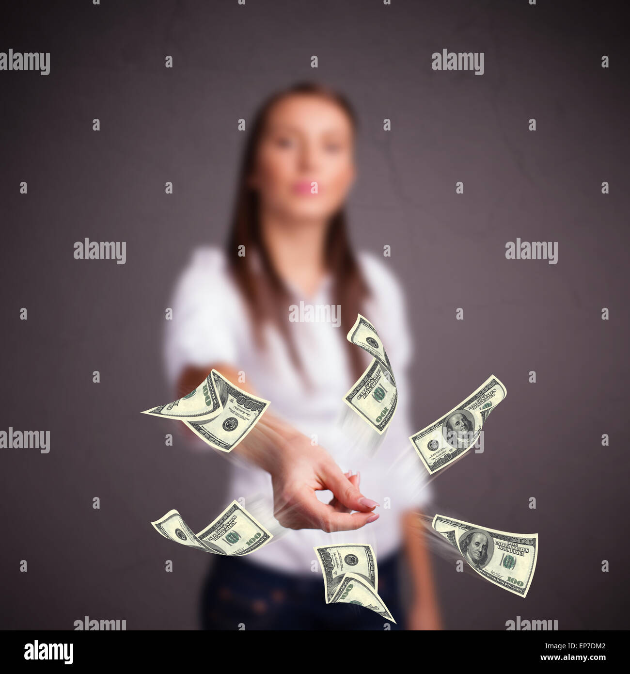 Young girl throwing money Stock Photo - Alamy