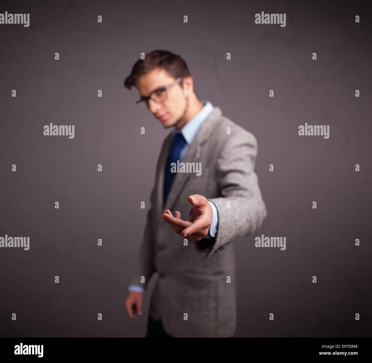 Young man standing and throwing something Stock Photo - Alamy