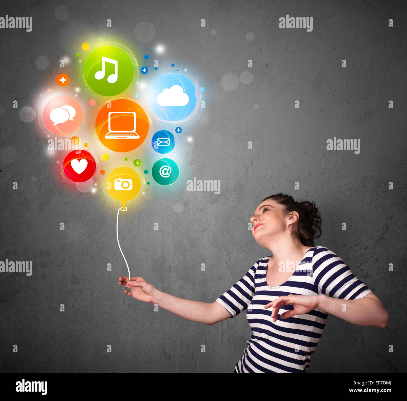 Woman holding social media balloon Stock Photo - Alamy