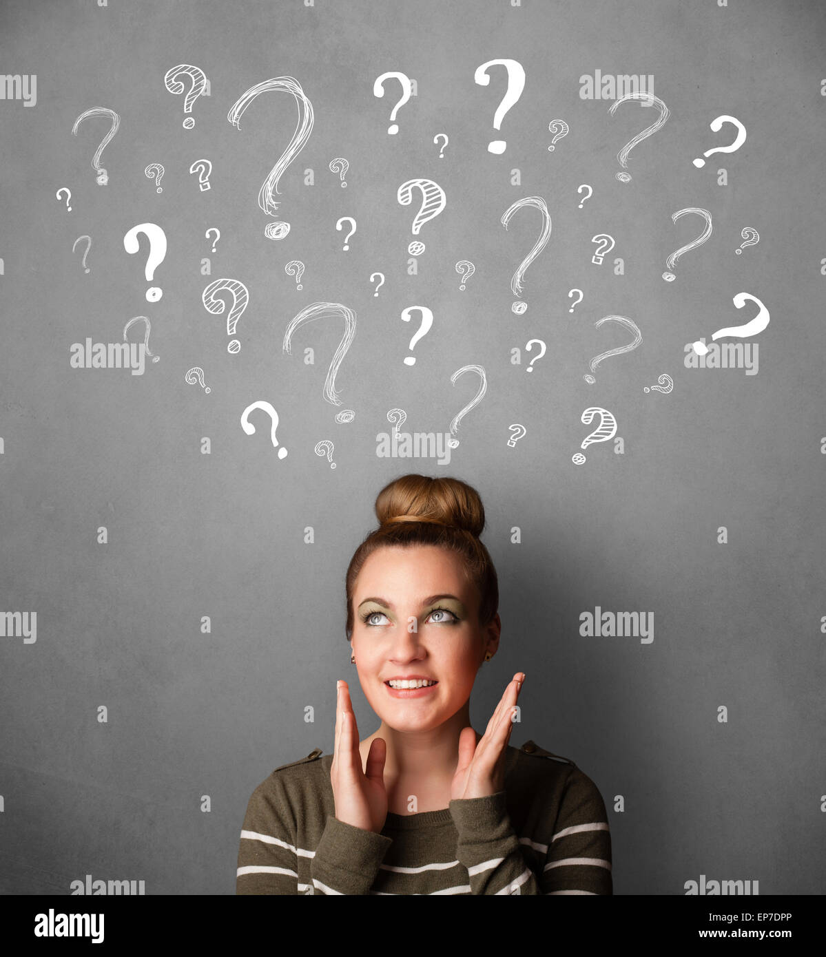 Young woman with question marks above her head Stock Photo - Alamy