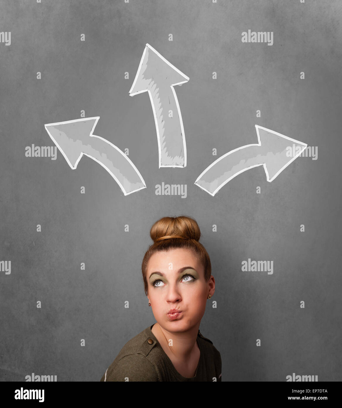 Young woman thinking with arrows above her head Stock Photo - Alamy