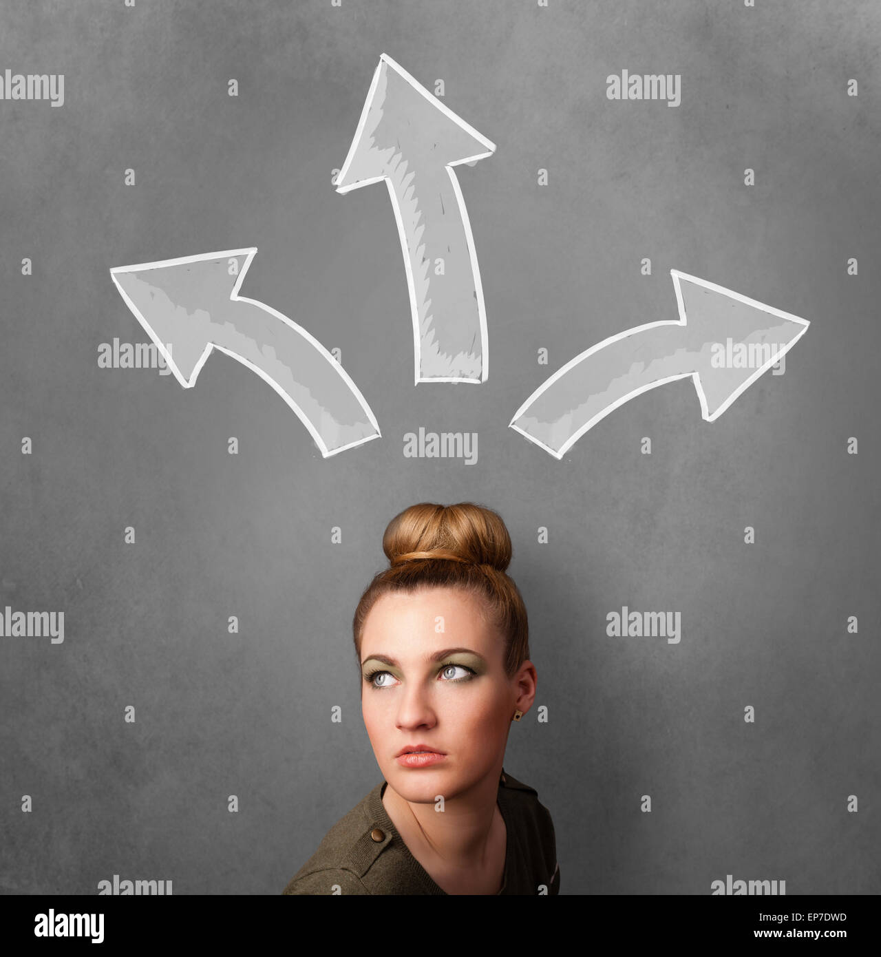 Young woman thinking with arrows above her head Stock Photo - Alamy