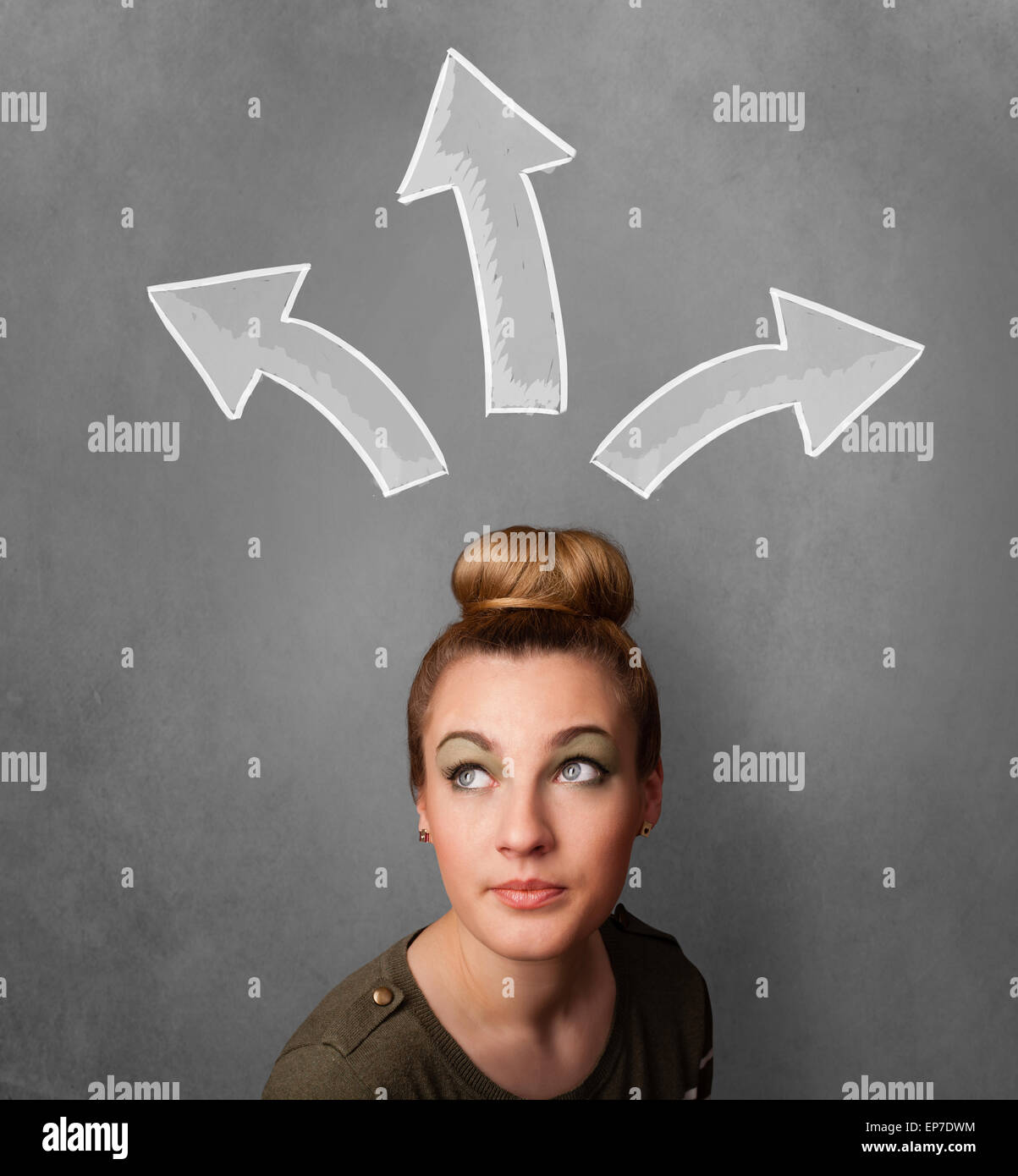 Young woman thinking with arrows above her head Stock Photo - Alamy