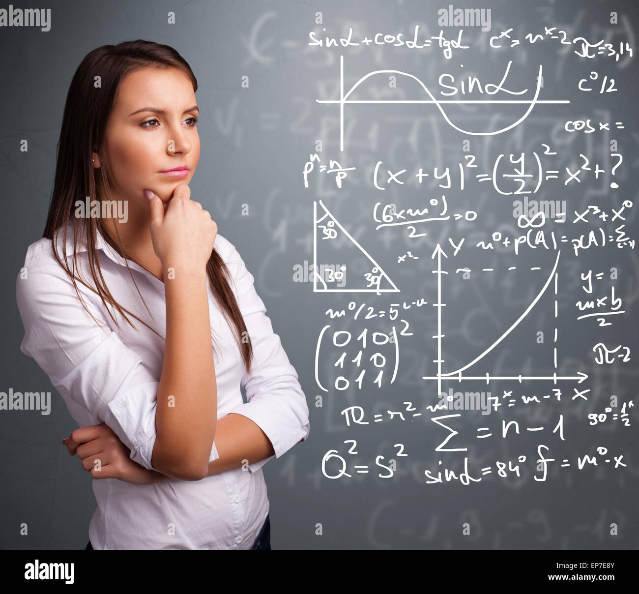 Beautiful school girl thinking about complex mathematical signs Stock ...