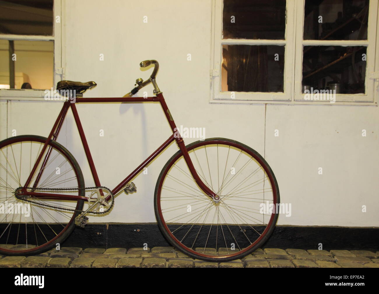 Single Old Simple Bicycle Leaning on White Wall Stock Photo - Alamy
