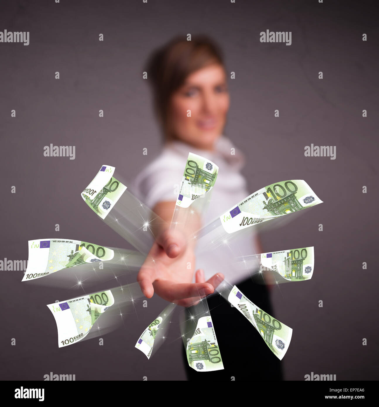 Pretty woman standing and throwing money Stock Photo - Alamy
