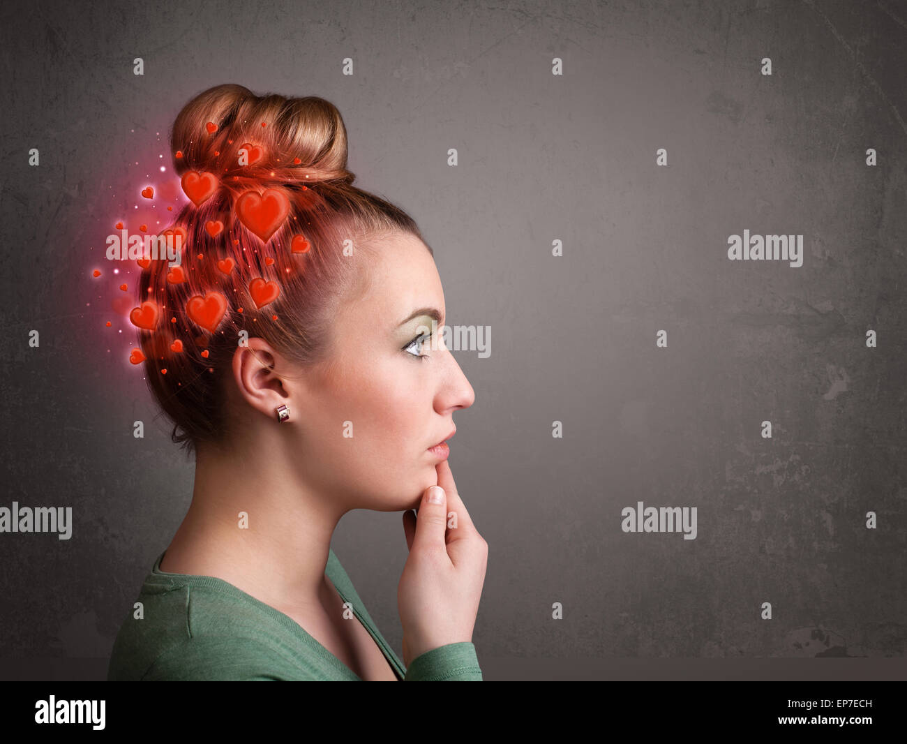 Young person thinking about love with red hearts Stock Photo - Alamy
