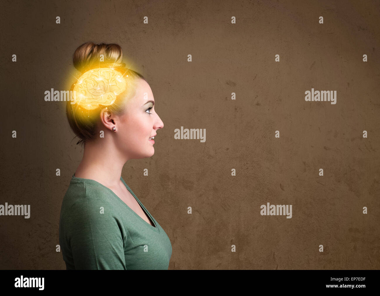 Young girl thinking with glowing brain illustration Stock Photo - Alamy