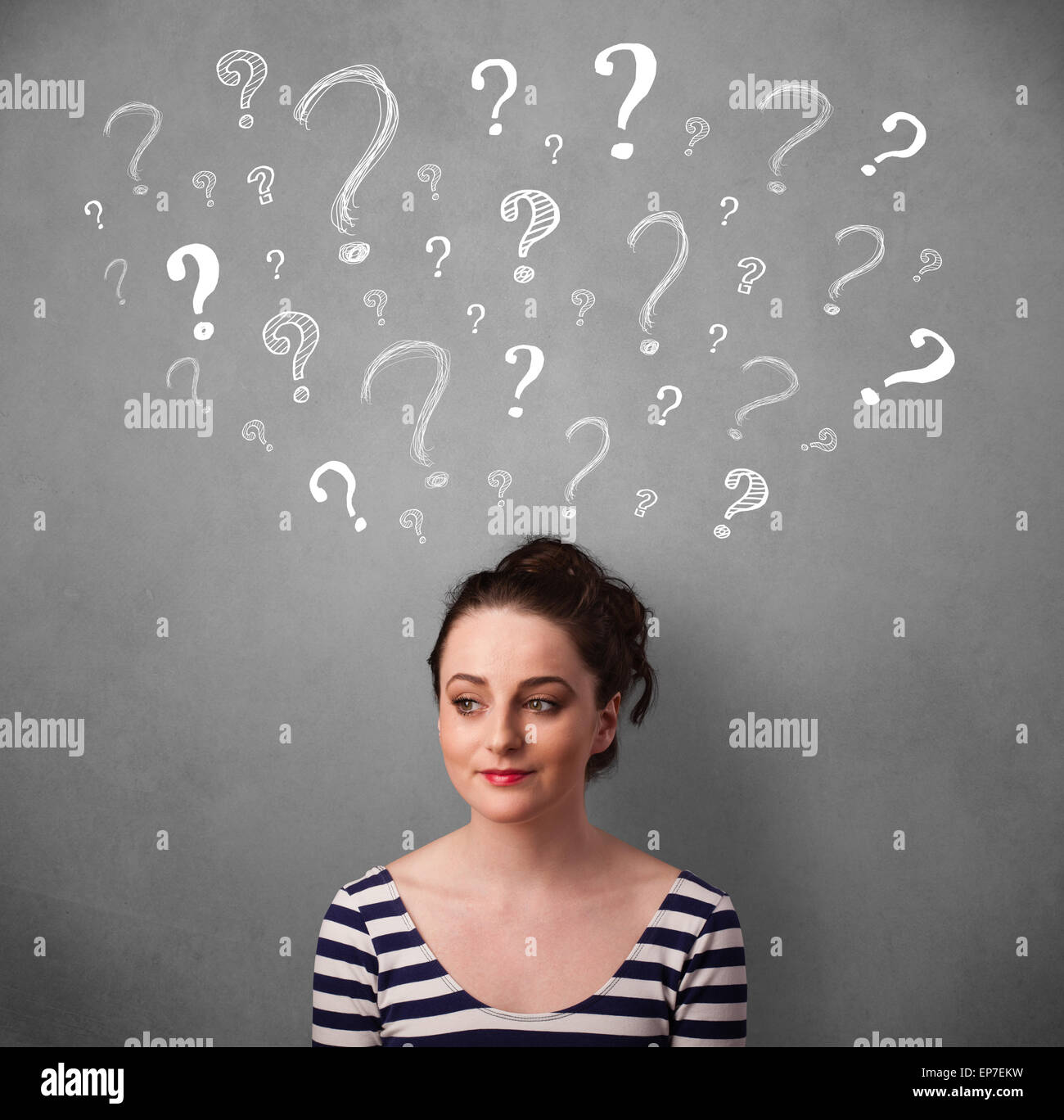 Young woman with question marks above her head Stock Photo - Alamy