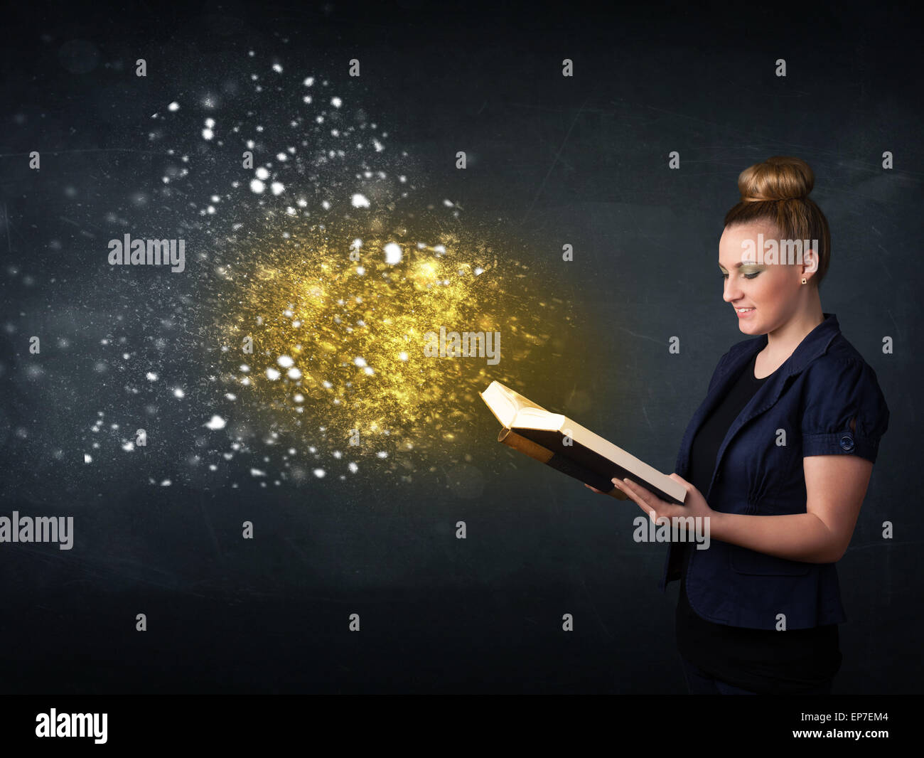 Young lady reading a magical book Stock Photo - Alamy