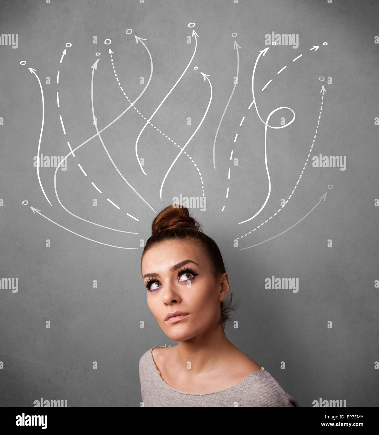 Young woman with arrows coming out of her head Stock Photo - Alamy