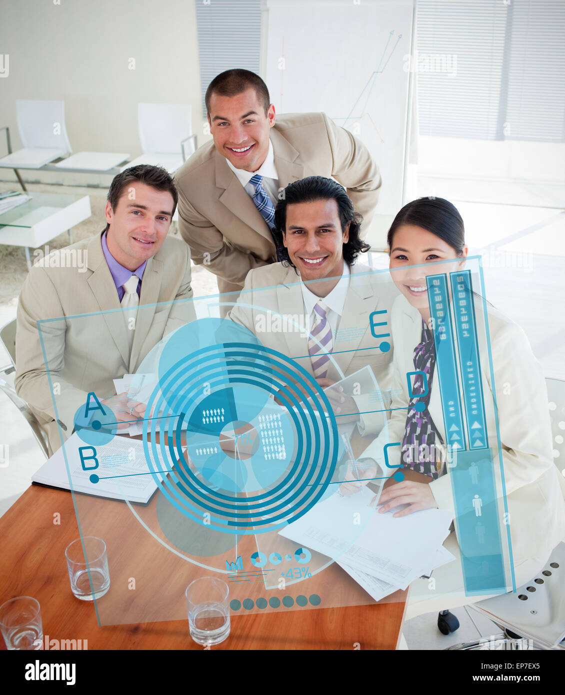 Overview of happy colleagues using blue chart interface Stock Photo - Alamy